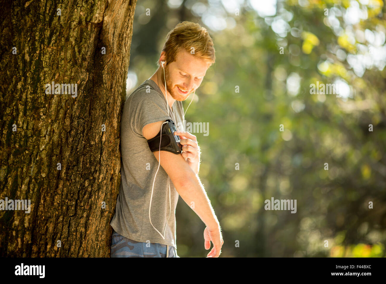 Young man resting outdoors Stock Photo - Alamy
