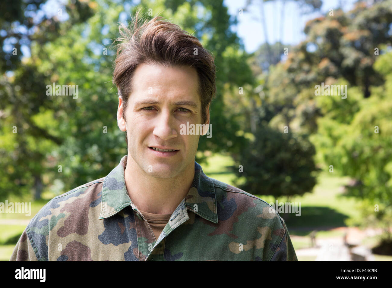 Distressed soldier looking at camera Stock Photo - Alamy