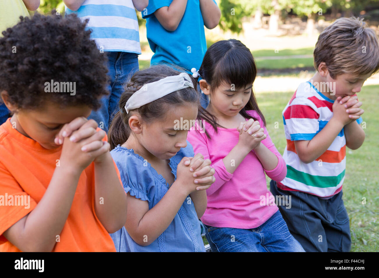 Children praying hi-res stock photography and images - Alamy