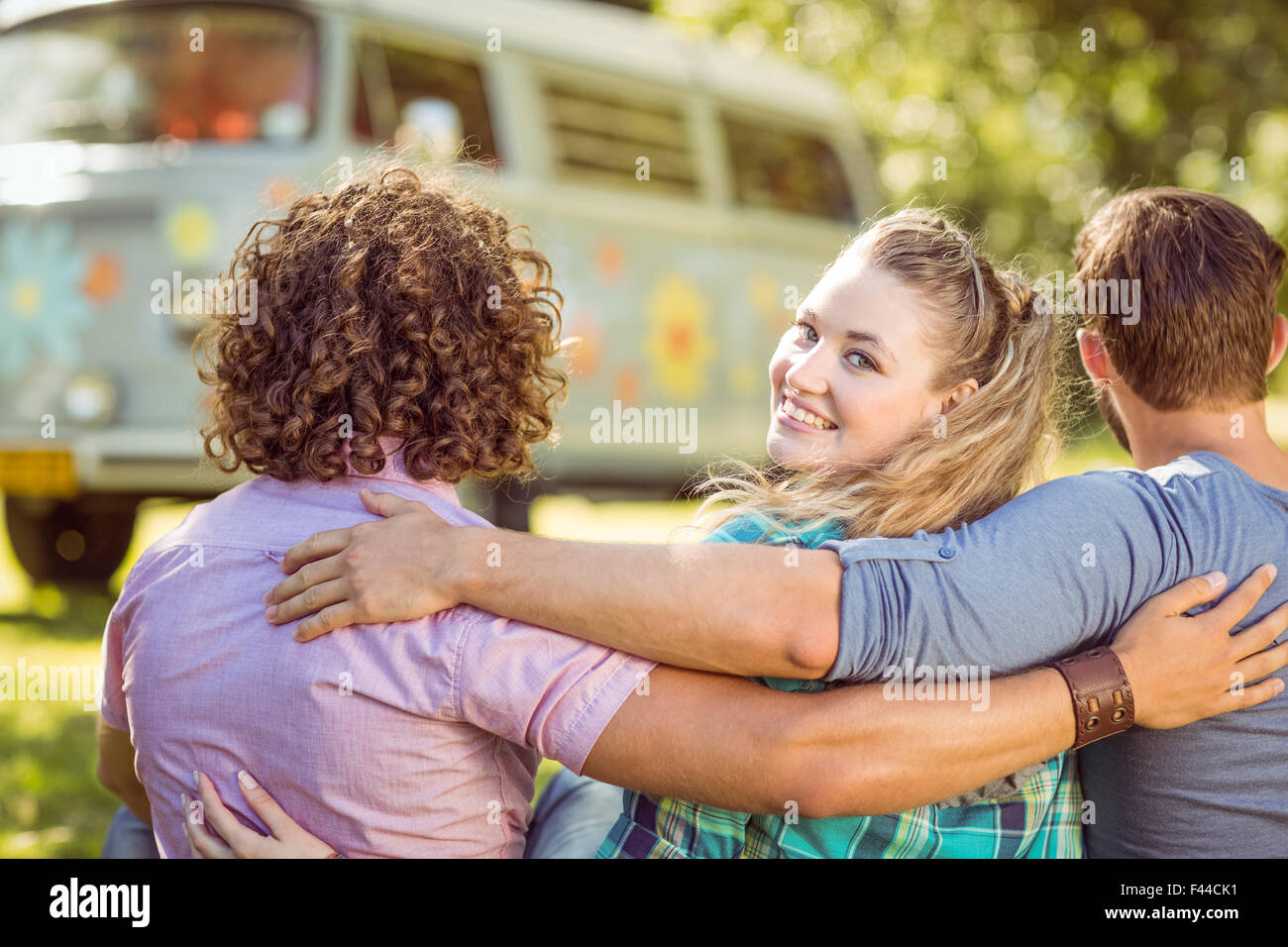 Smiling friends with arm around road hi-res stock photography and ...