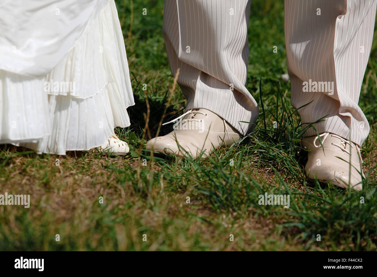 Legs of the groom and the bride Stock Photo - Alamy