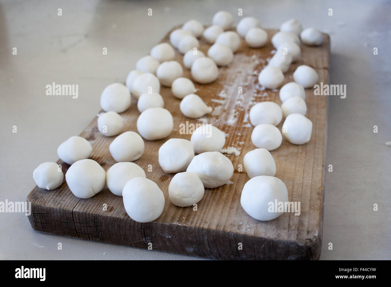 Mochi rice cake balls on wooden cutting board Stock Photo - Alamy