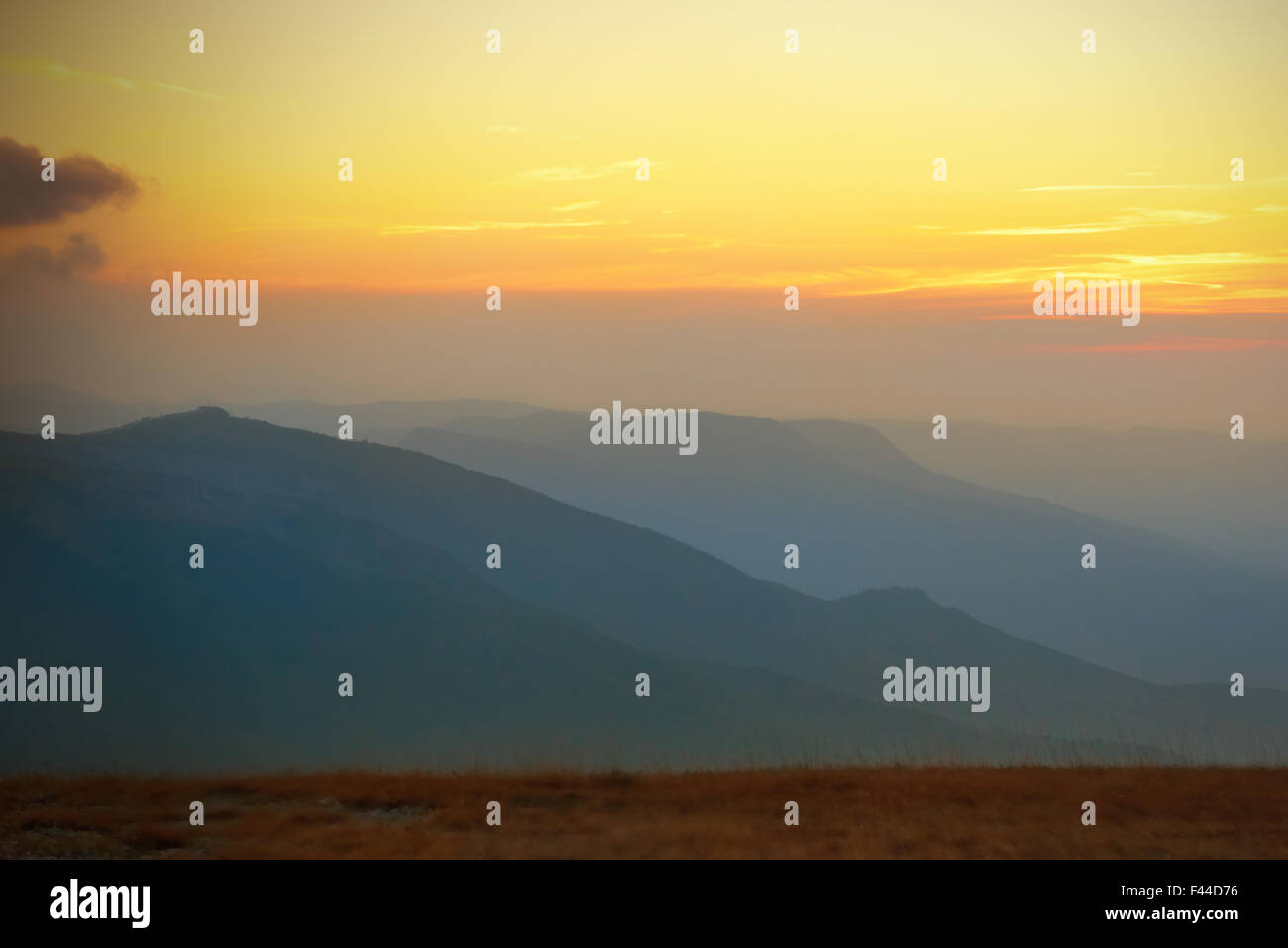 Beautiful sunset at the mountains Stock Photo - Alamy