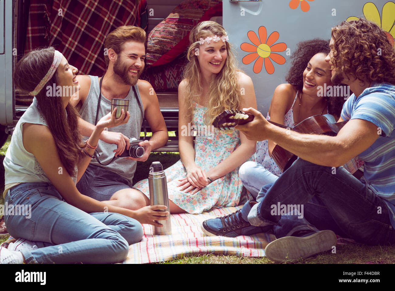 Hipster friends by camper van at festival Stock Photo - Alamy