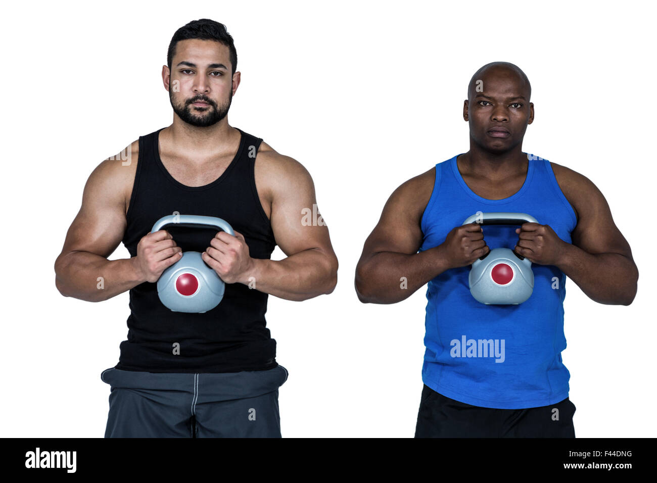 Strong friends lifting kettlebells together Stock Photo - Alamy