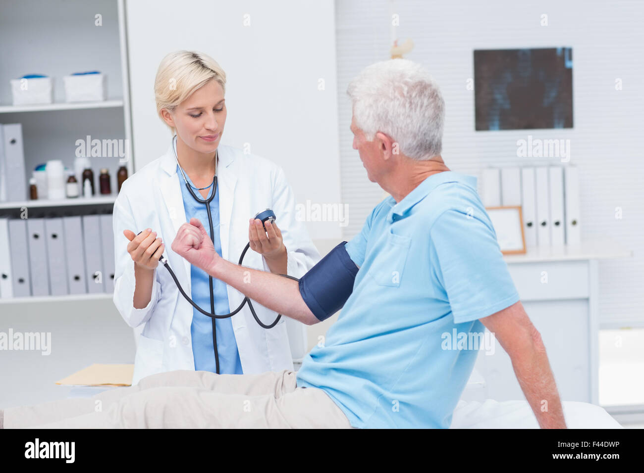 Doctor checking senior man`s hi-res stock photography and images - Alamy