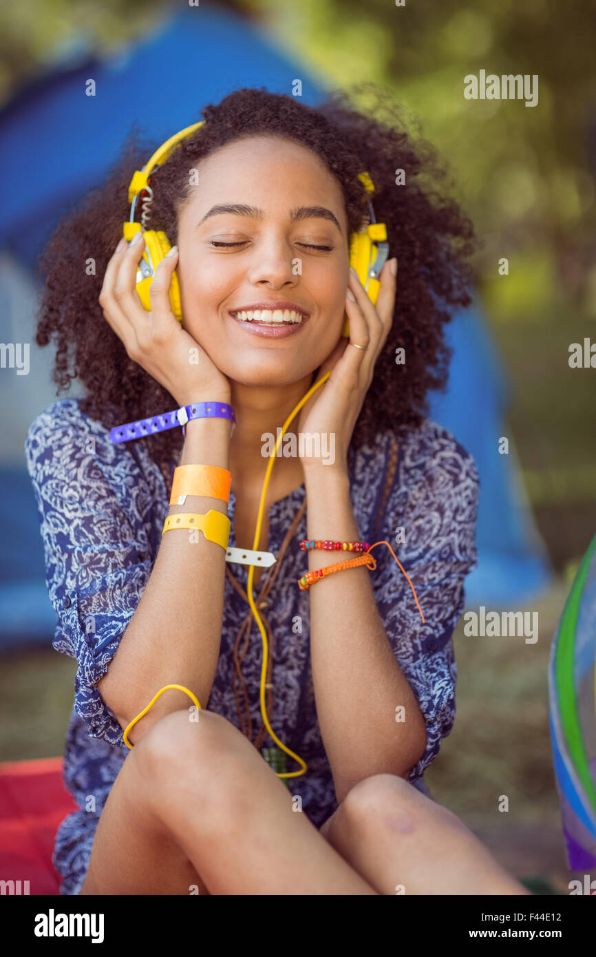 Pretty hipster listening to music Stock Photo - Alamy