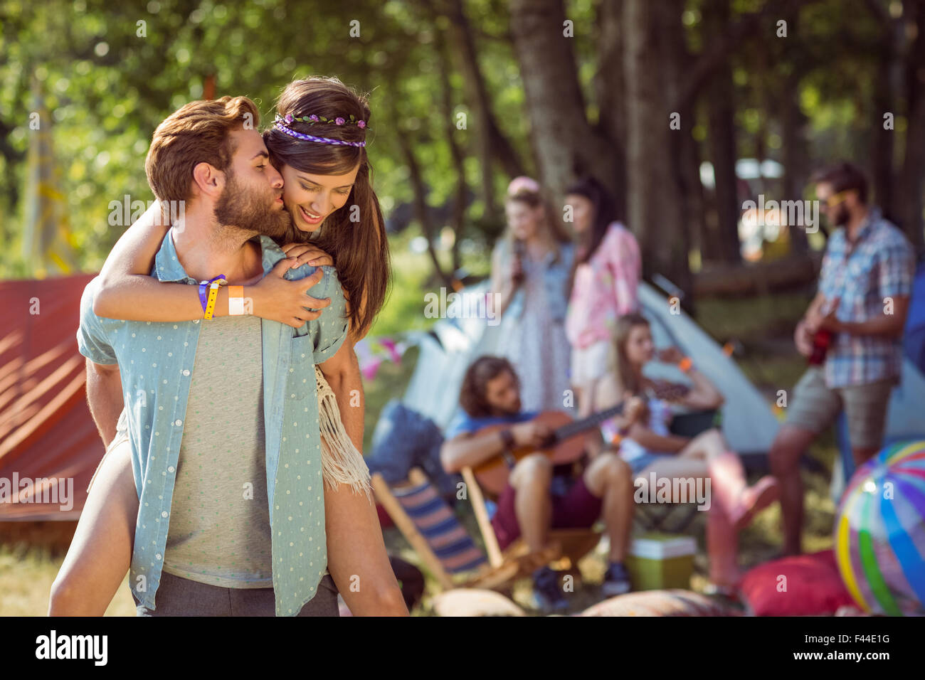 Hipster couple having fun on campsite Stock Photo - Alamy