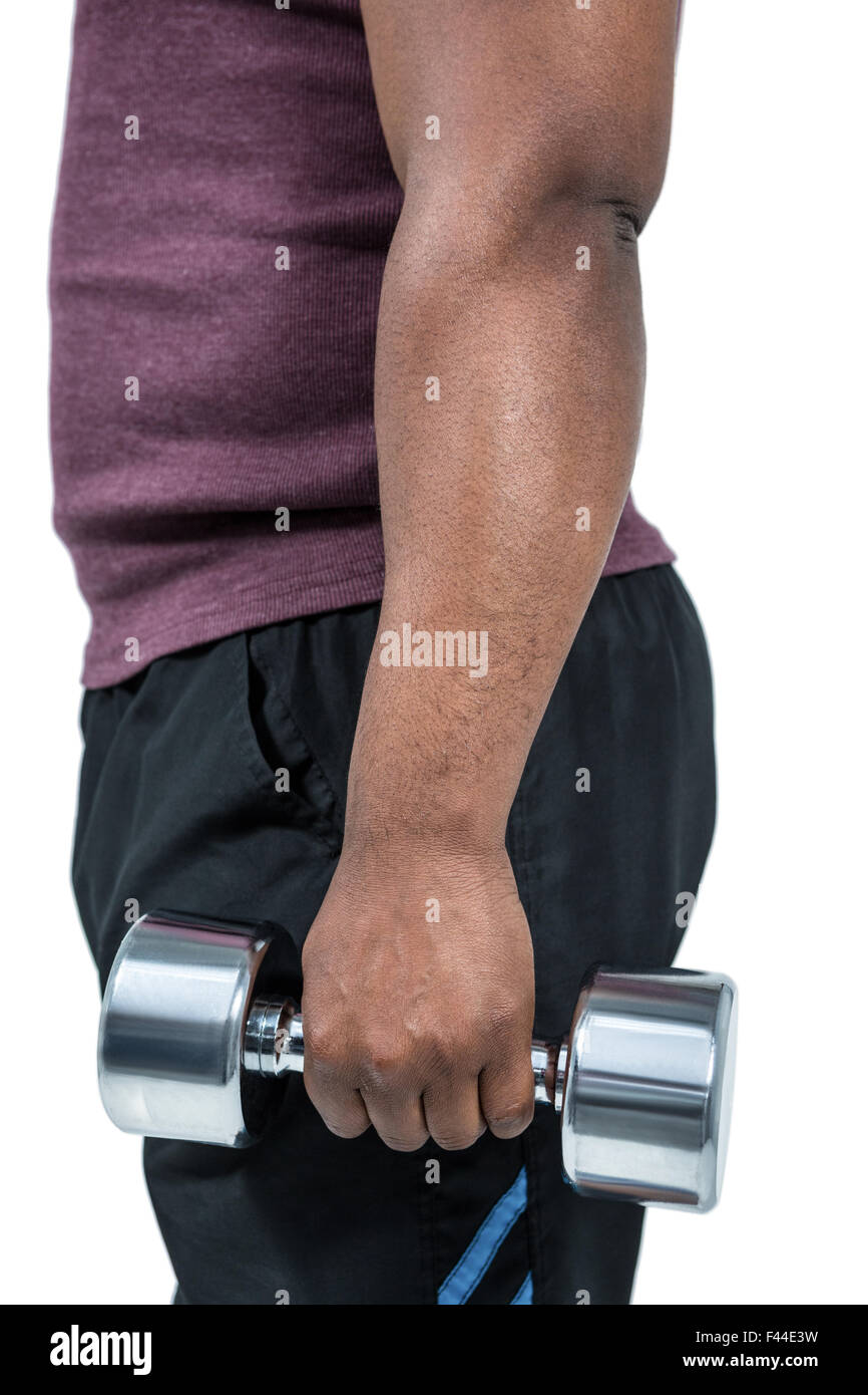 Fit man exercising with dumbbell Stock Photo - Alamy