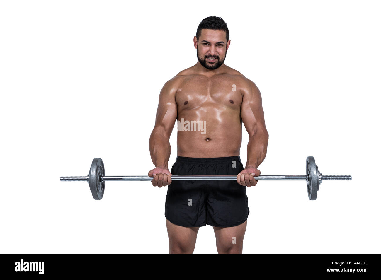 Muscular man lifting heavy barbell Stock Photo - Alamy