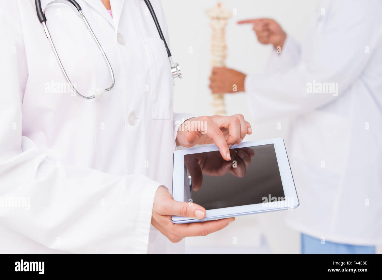 Doctor using tablet pc Stock Photo - Alamy