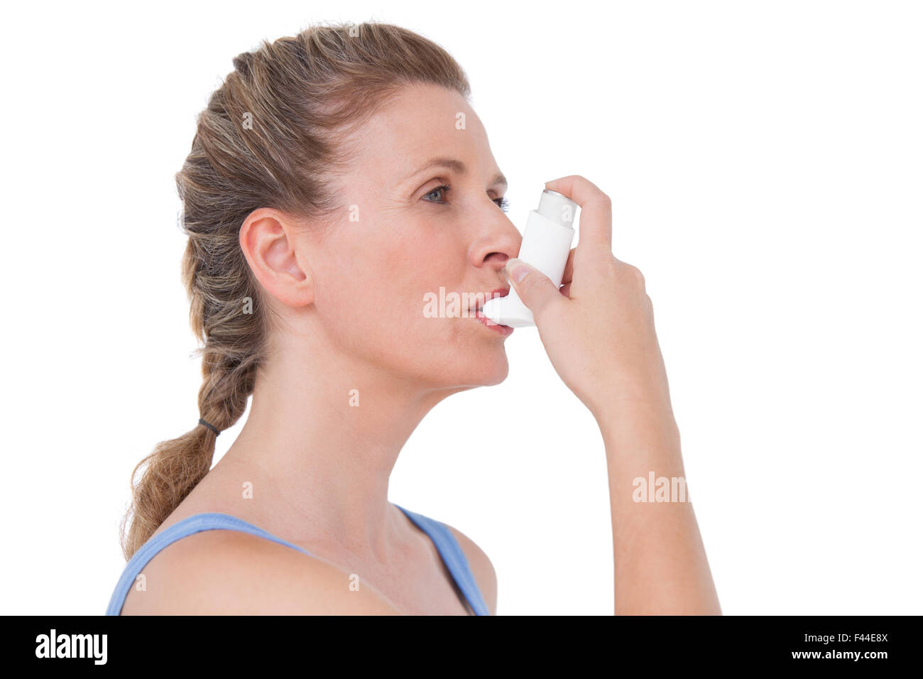 Woman using inhaler for asthma Stock Photo - Alamy
