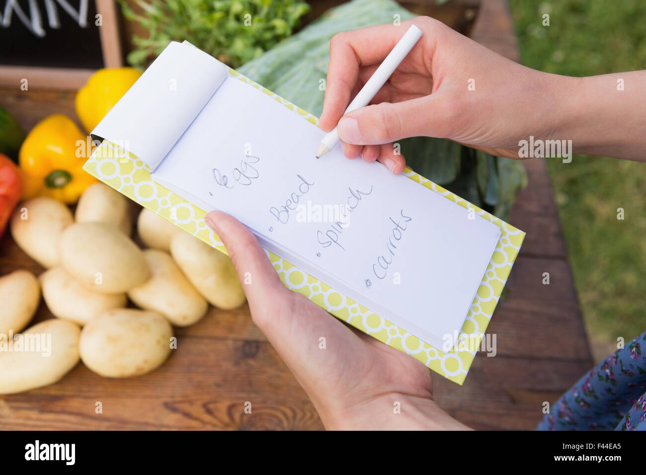 Woman checking her shopping list Stock Photo - Alamy