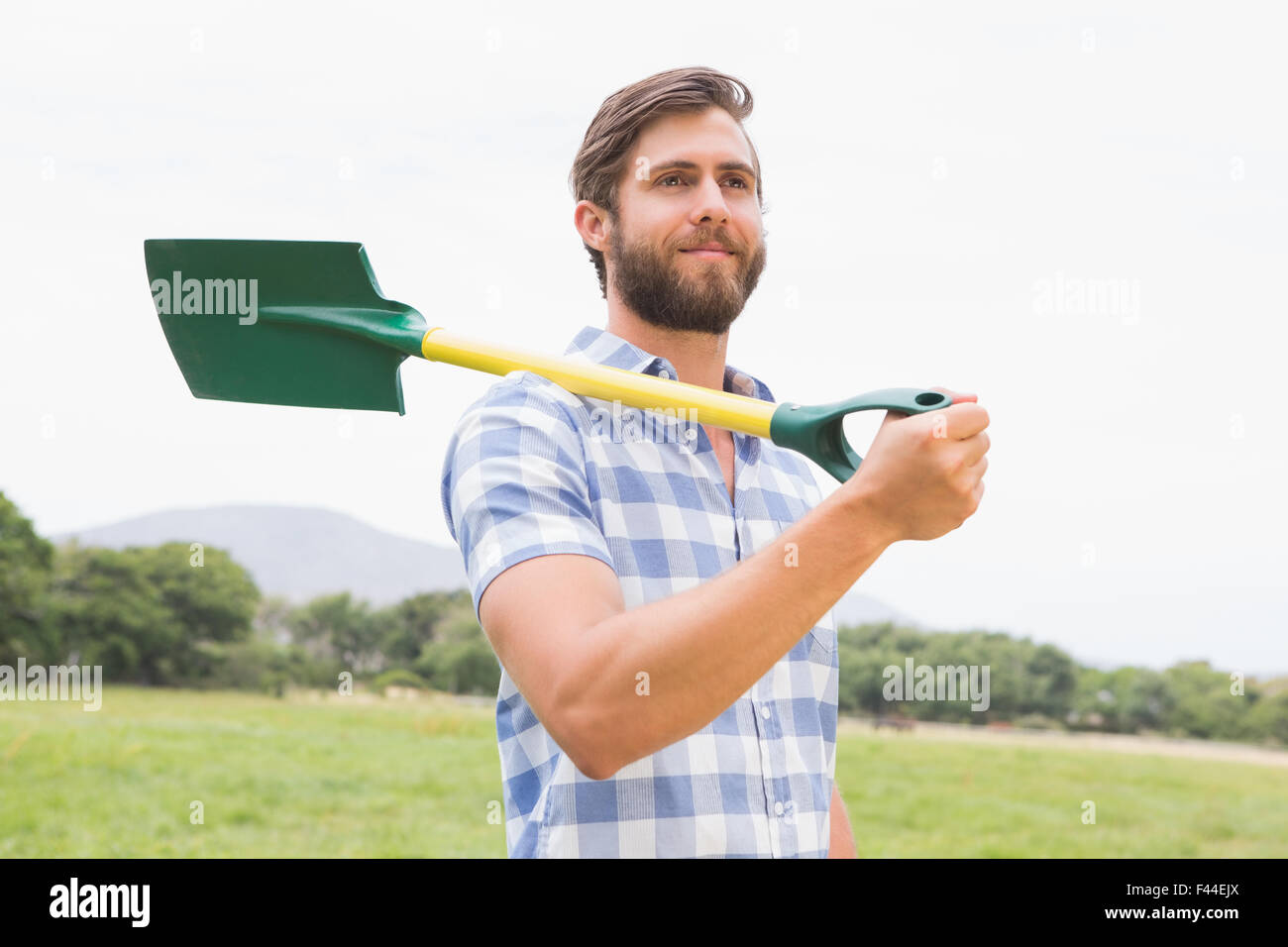 Happy man with his shovel Stock Photo - Alamy