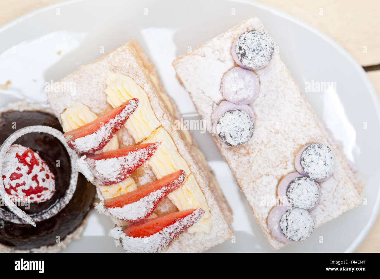 selection of fresh cream cake dessert plate Stock Photo - Alamy