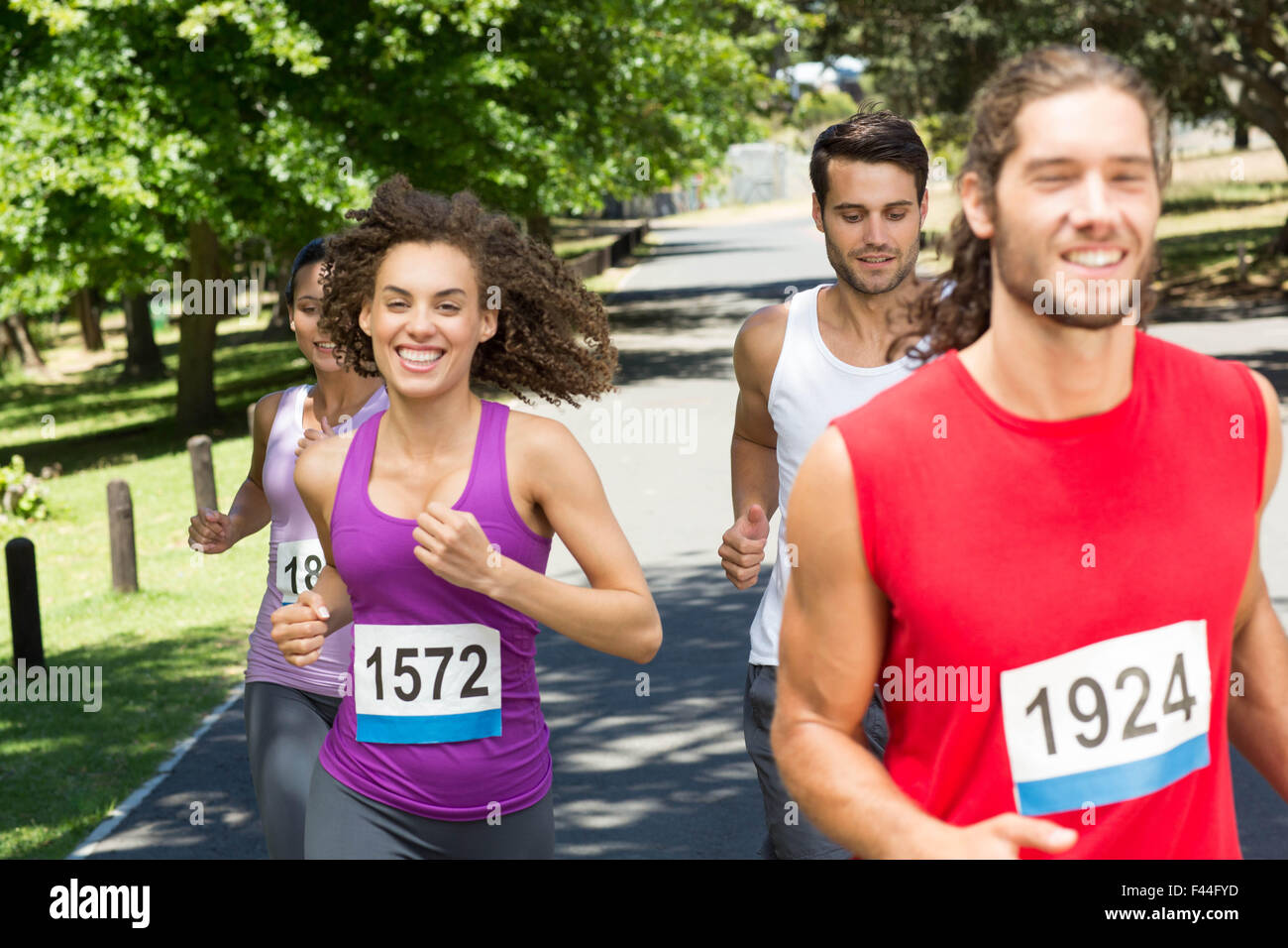 Fit people running race in park Stock Photo - Alamy