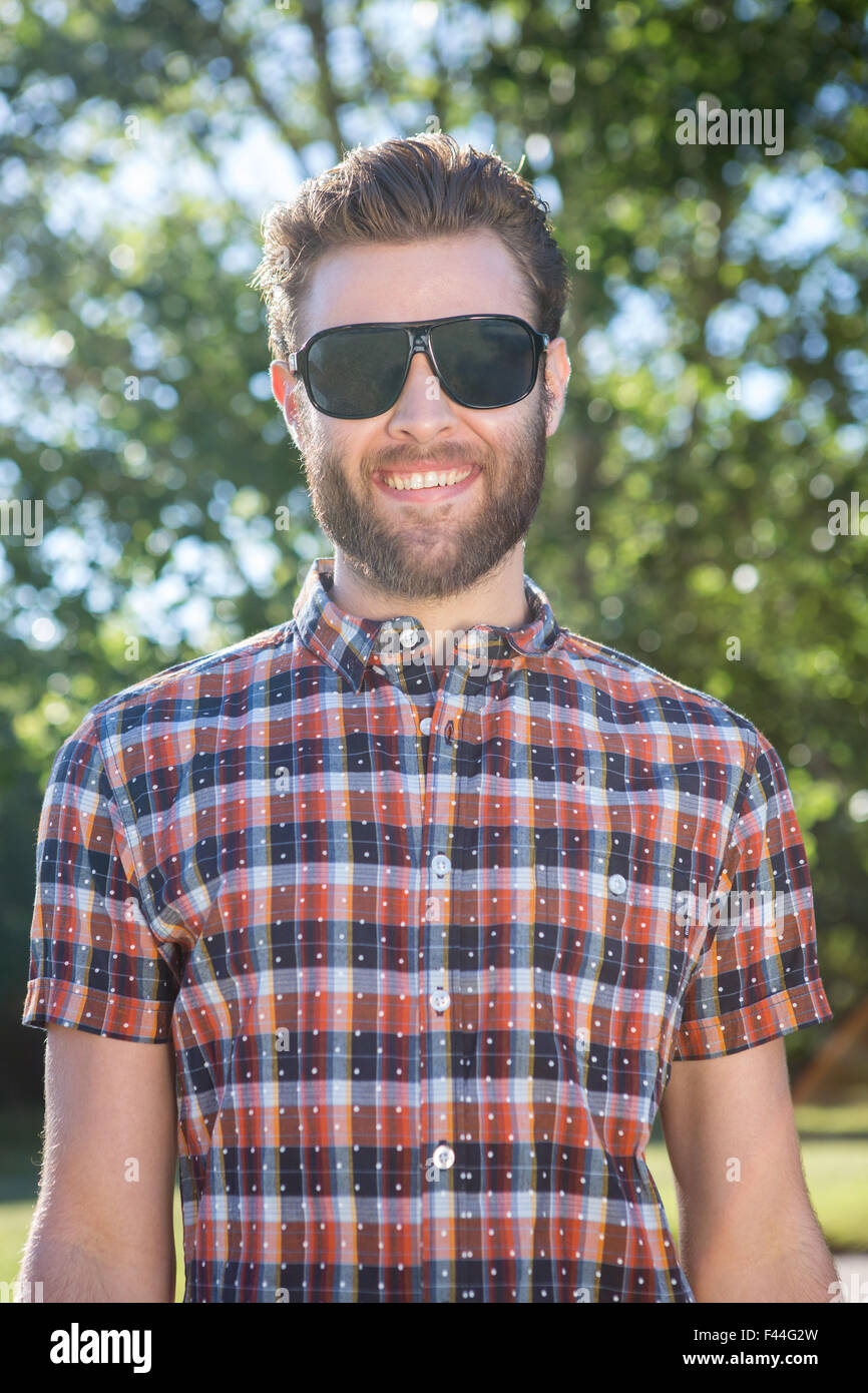 Handsome hipster smiling at camera Stock Photo - Alamy