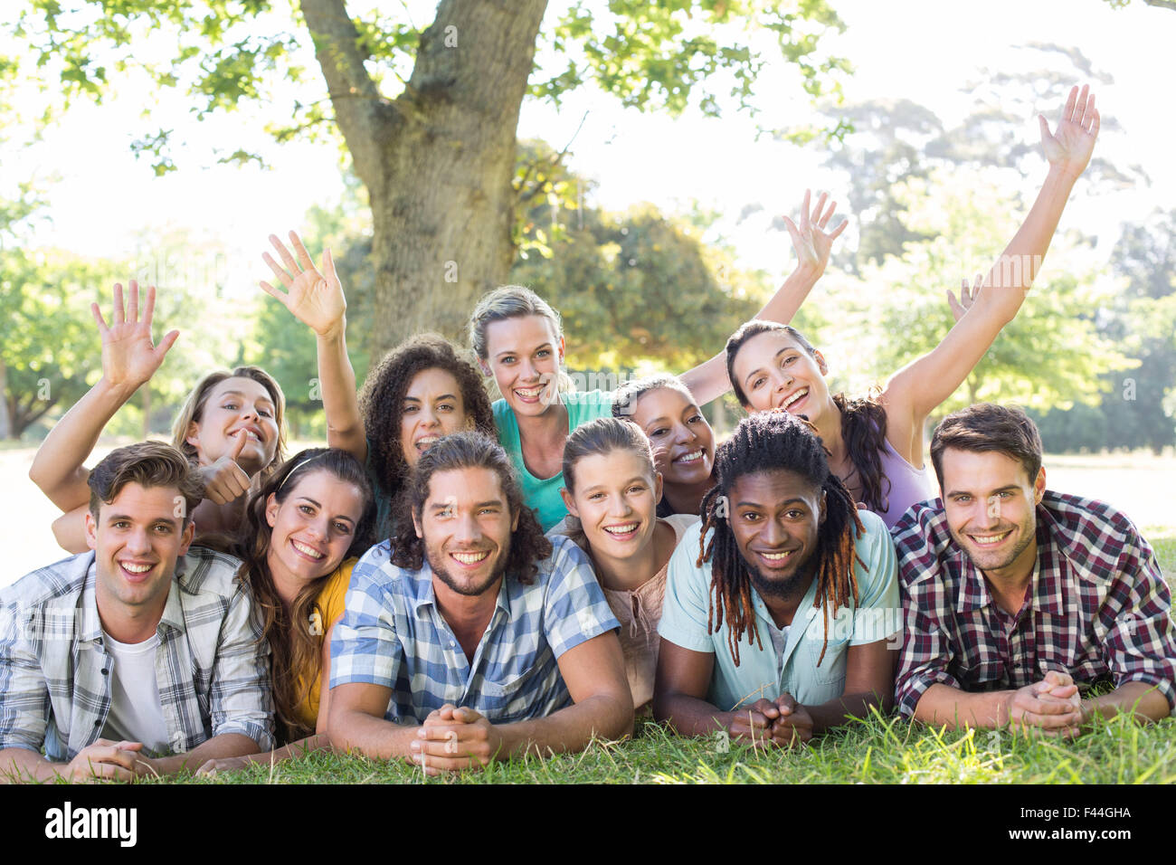 Happy friends in the park Stock Photo - Alamy