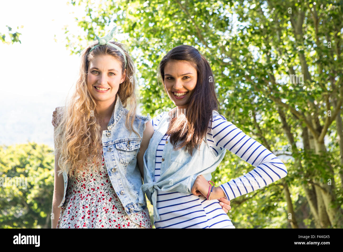 Happy friends smiling at camera Stock Photo - Alamy