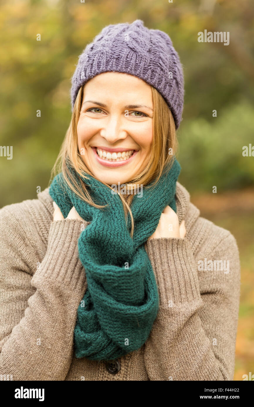 Smiling pretty woman holding her scarf Stock Photo - Alamy