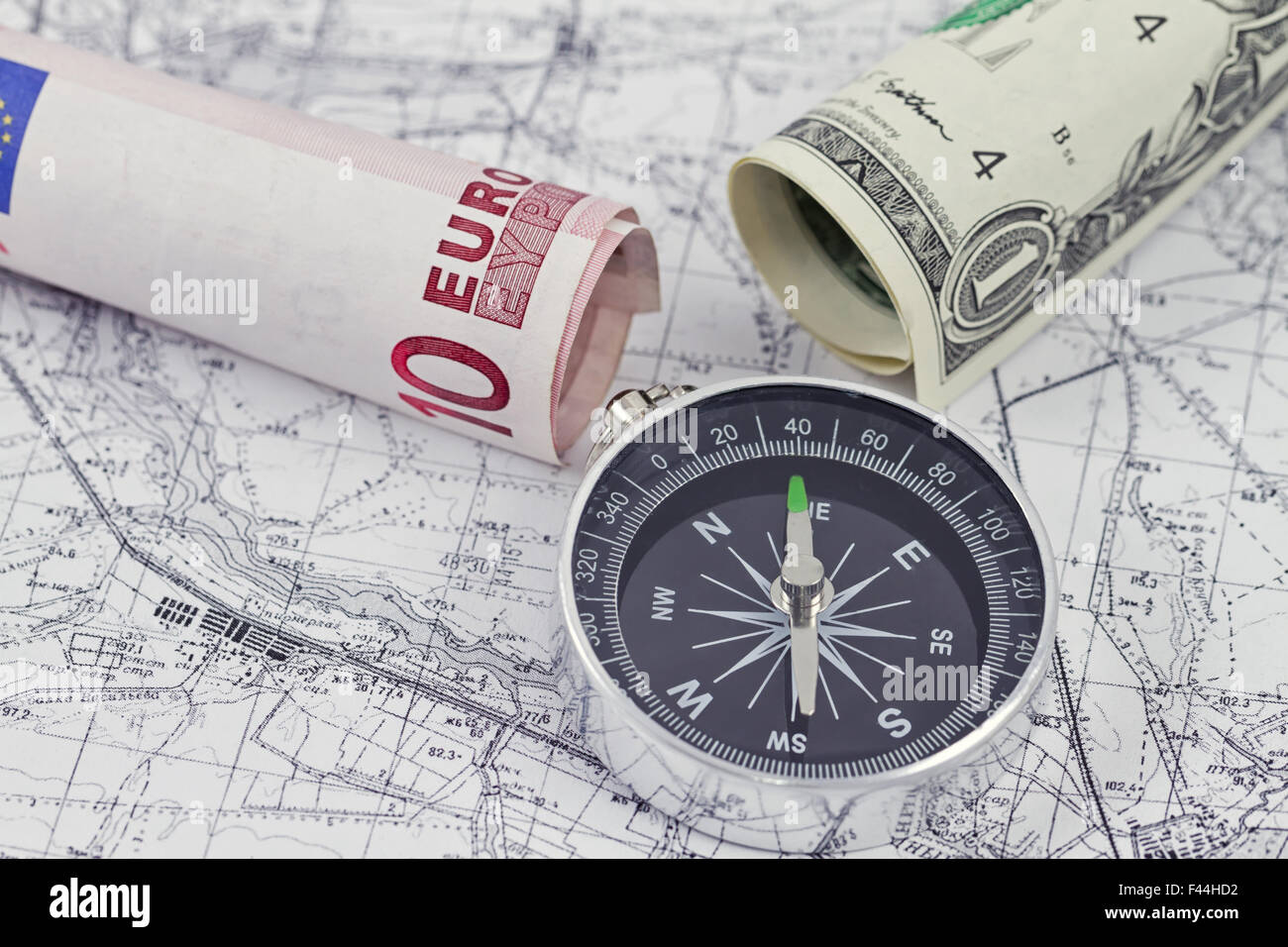 compass, money and map Stock Photo - Alamy