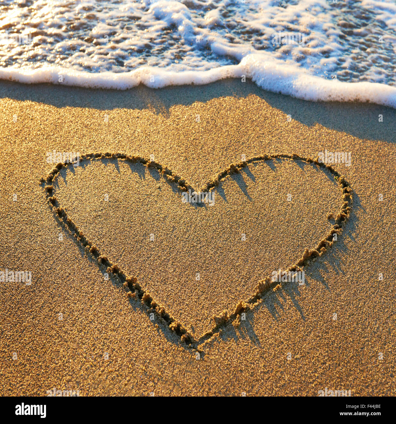 Heart on the sand Stock Photo - Alamy