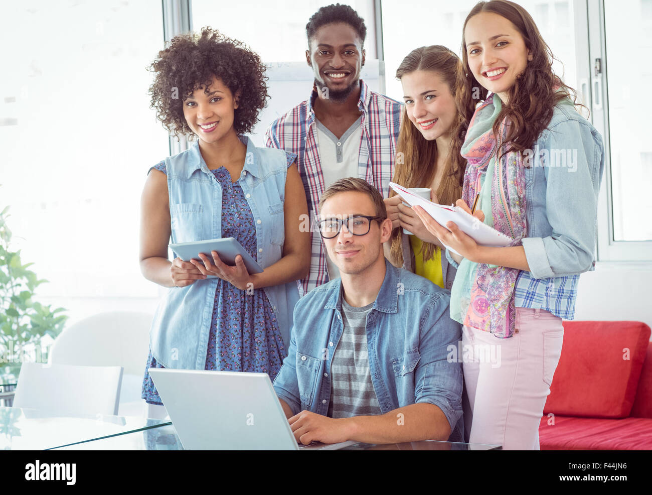 Smiling student holding notepad classmates hi-res stock photography and ...