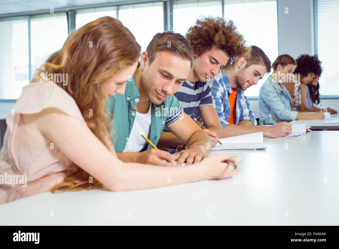 Fashion students taking notes in class Stock Photo - Alamy