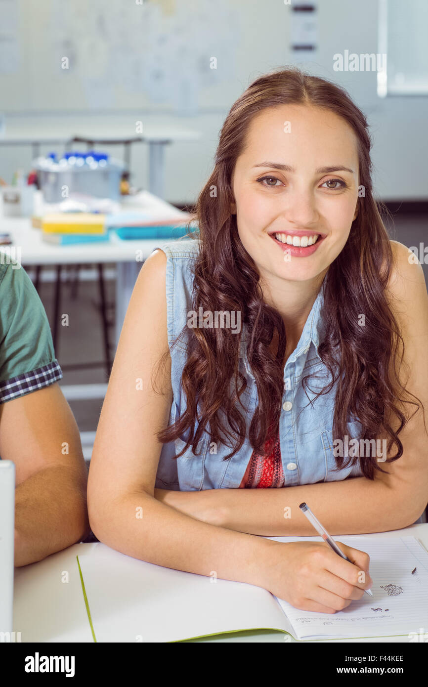 Student taking notes in class Stock Photo - Alamy
