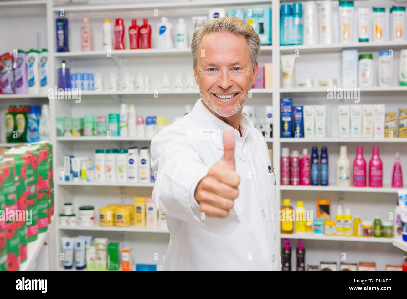 Smiling positive male pharmacist hi-res stock photography and images ...