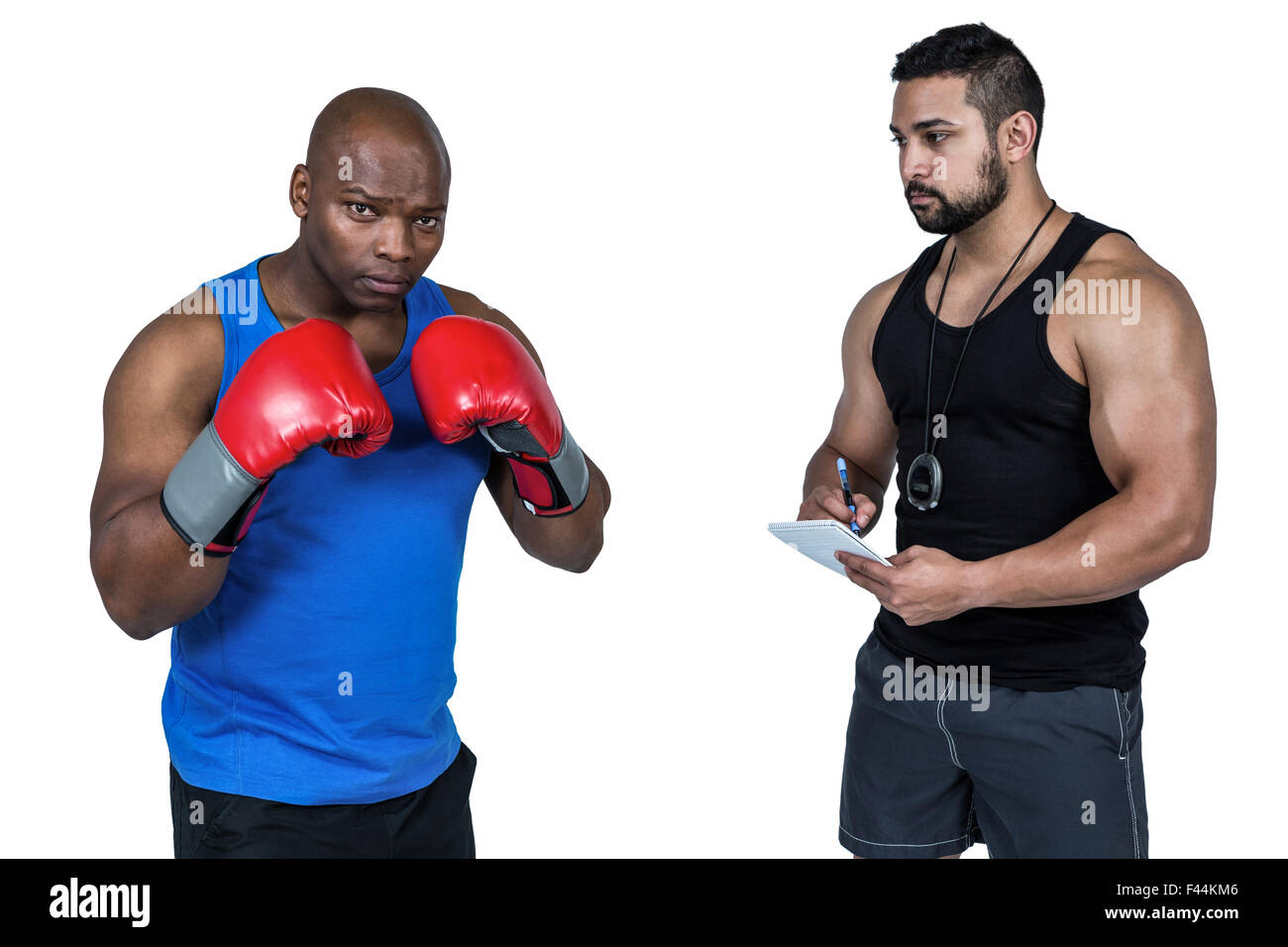 Strong friends using kettlebells together Stock Photo - Alamy