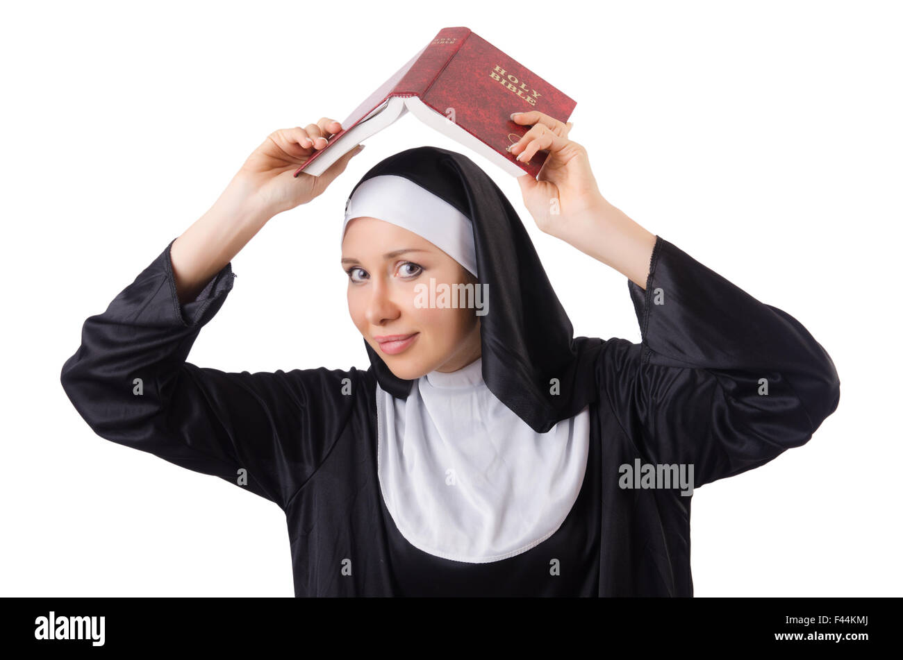 Pretty nun with Bible isolated on white Stock Photo - Alamy