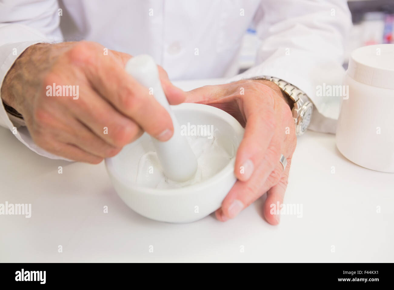 Close up of pharmacist mixing medicine Stock Photo - Alamy