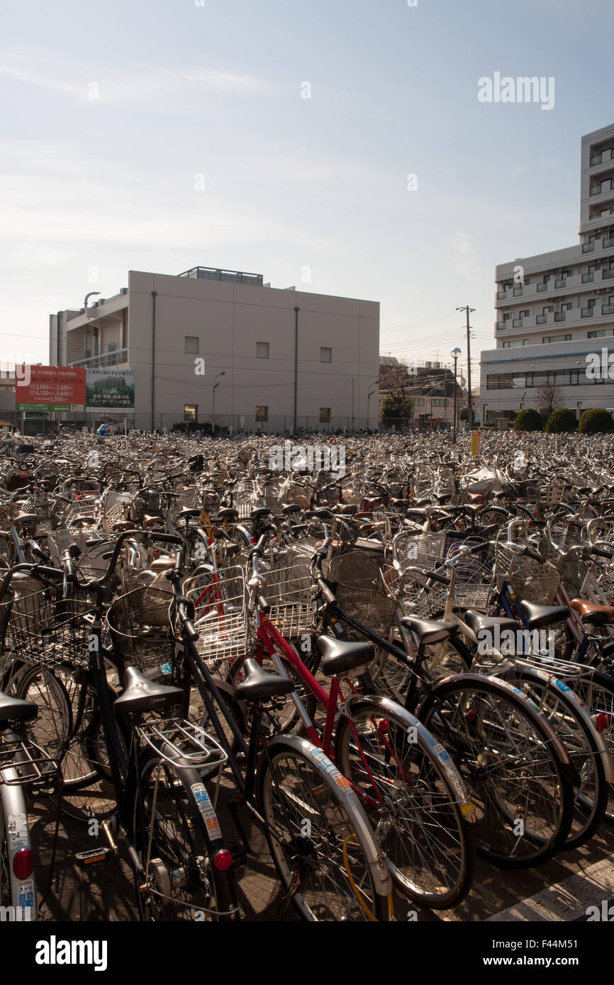 Filled bicycle parking lot with blue sky Stock Photo - Alamy