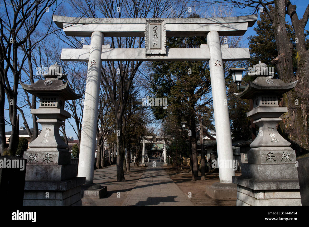 Shinto concrete gate and pathway Stock Photo - Alamy