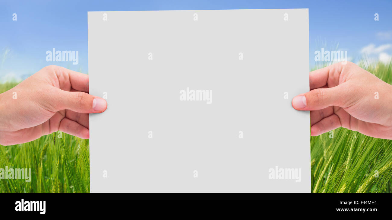 Composite image of hand showing card Stock Photo - Alamy