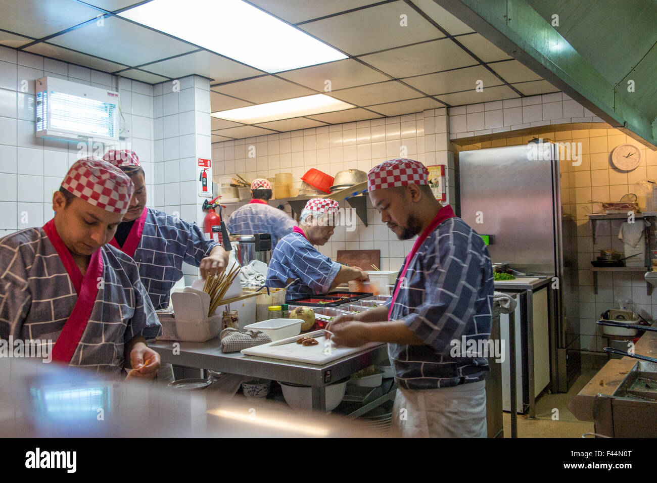 Japanese chefs working in a restaurant kitchen Stock Photo - Alamy