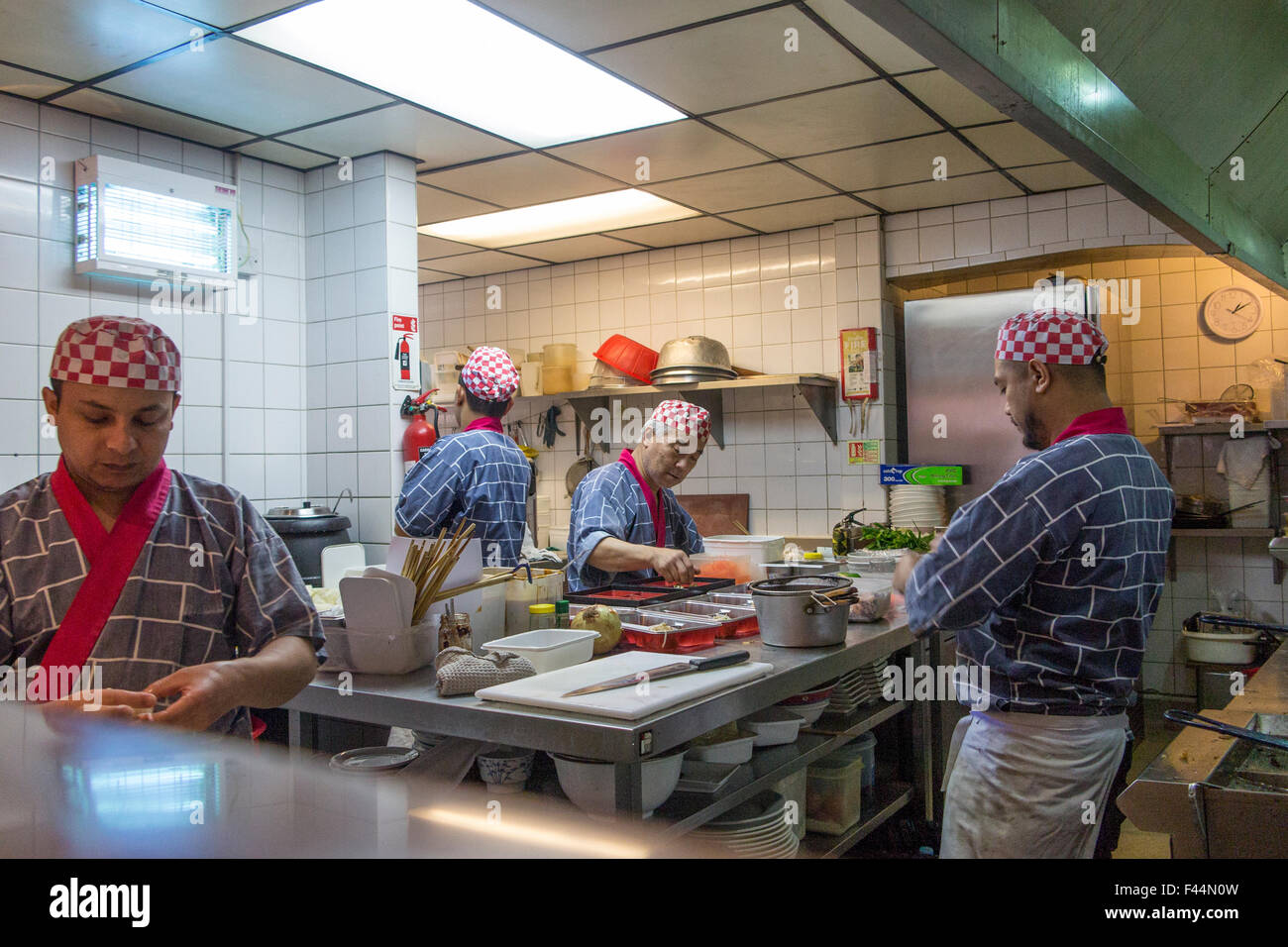 Japanese chefs working in a restaurant kitchen Stock Photo - Alamy