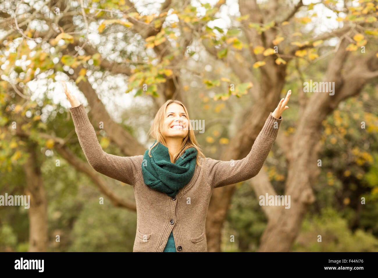 Young woman raised arms hi-res stock photography and images - Alamy