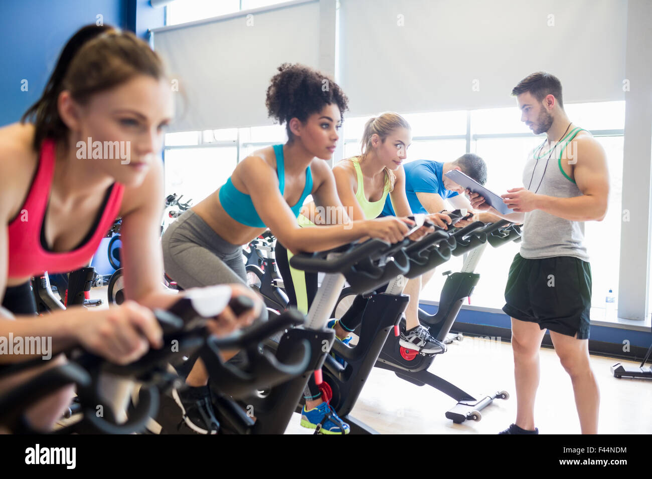 Fit people in a spin class Stock Photo - Alamy