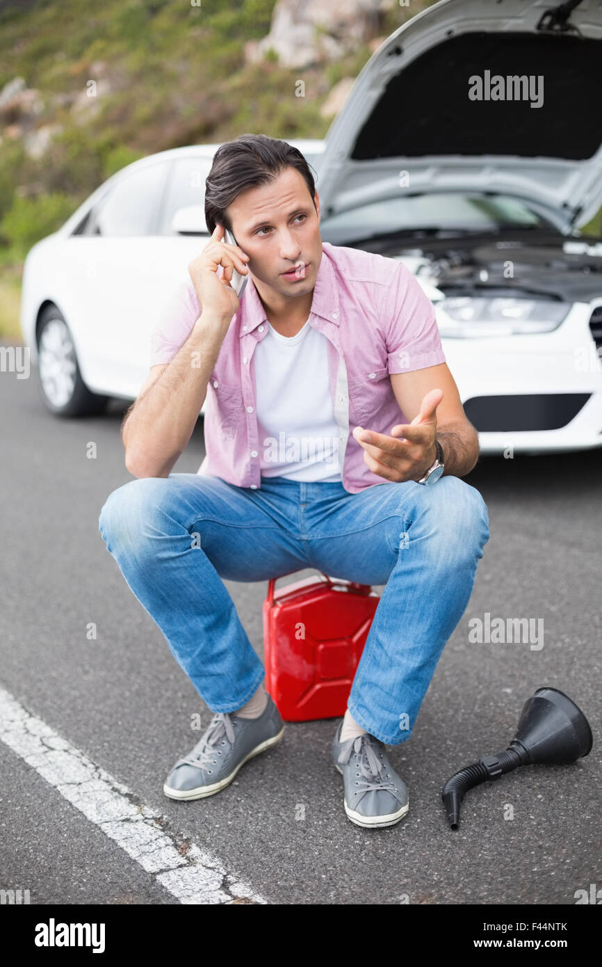 Man after a car breakdown Stock Photo - Alamy