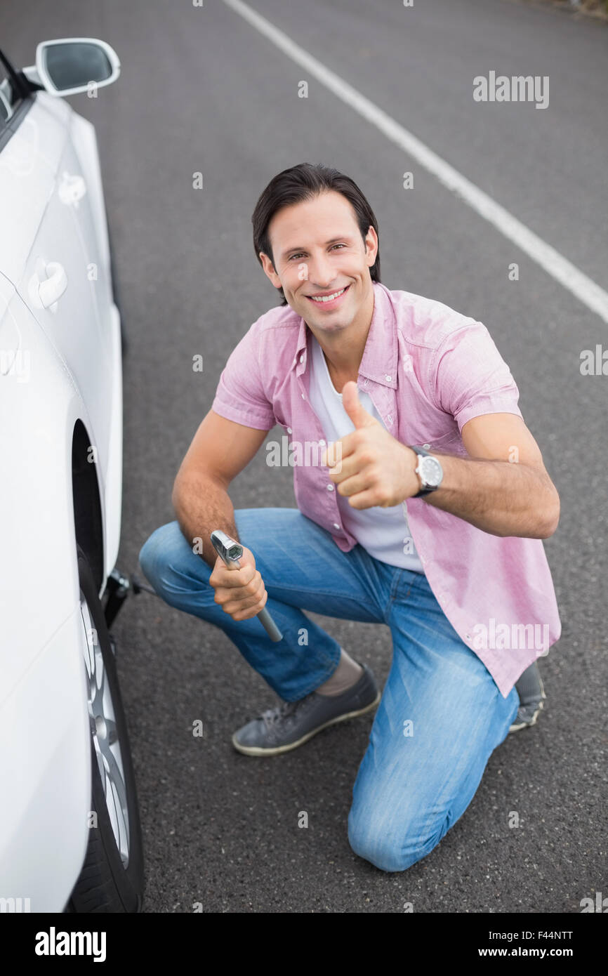 Man changing wheel after a car breakdown Stock Photo - Alamy