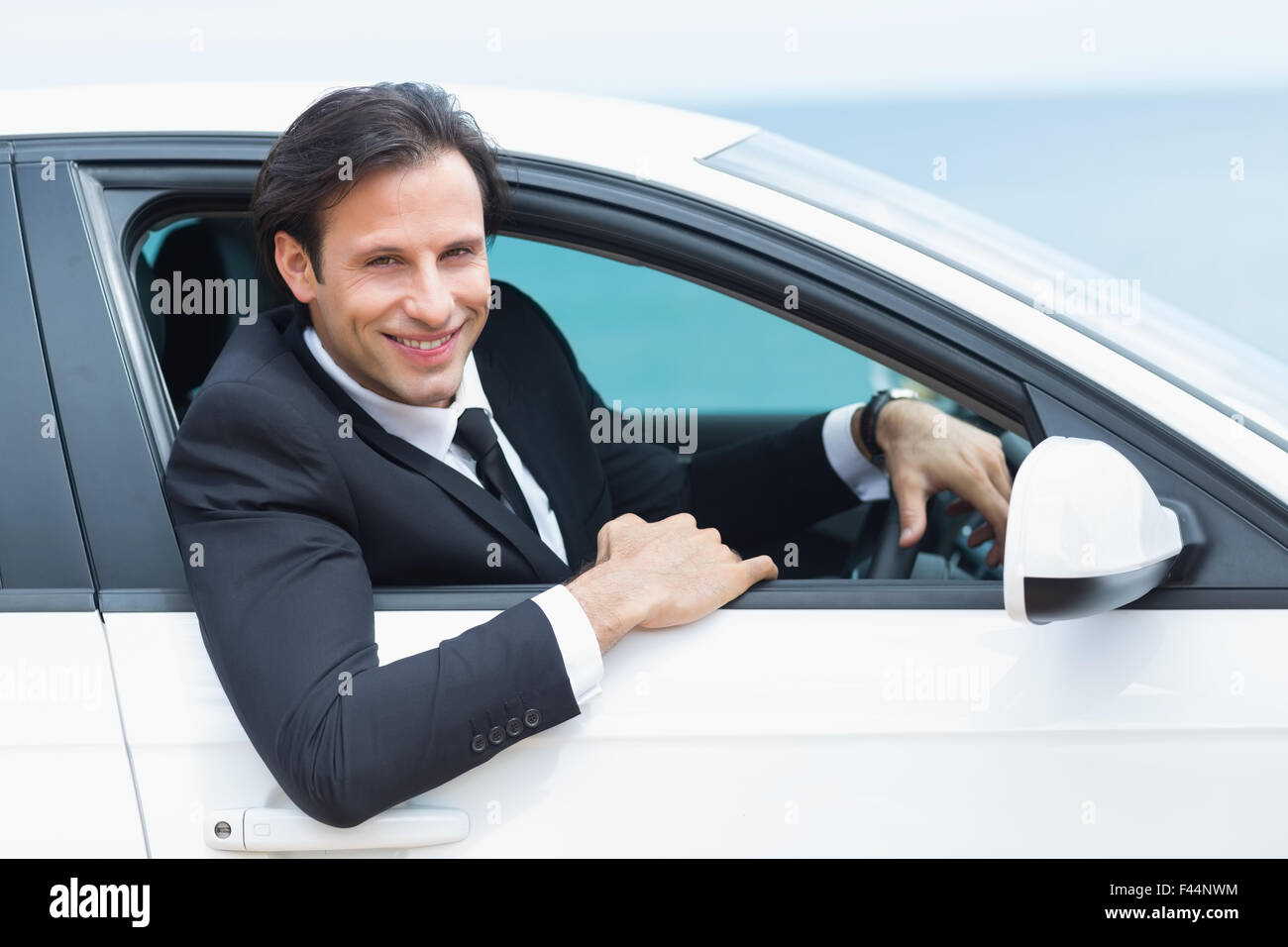 Happy driving businessman Stock Photo - Alamy