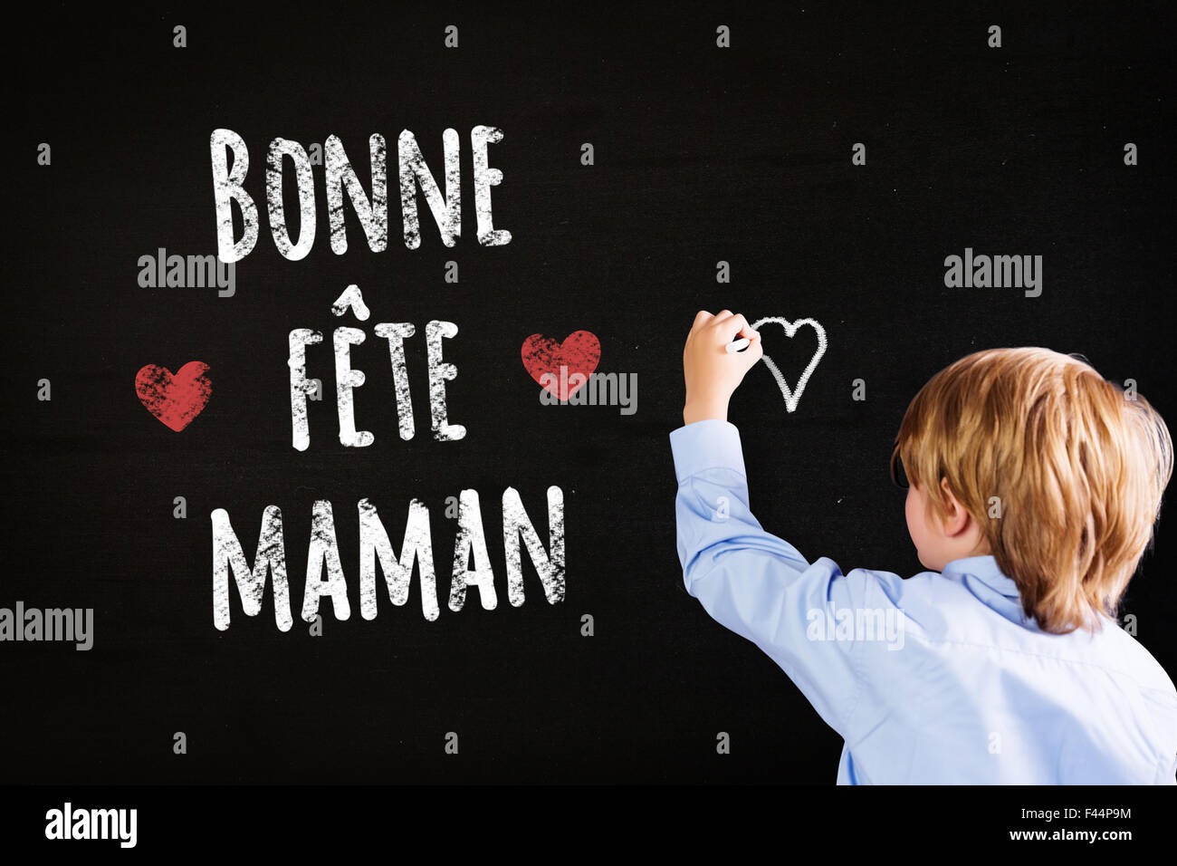 Composite image of cute pupil writing Stock Photo - Alamy