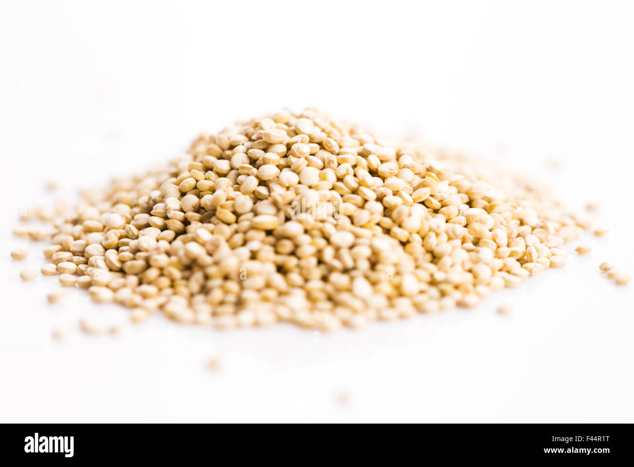 Pile of quinoa grain on a white background Stock Photo - Alamy