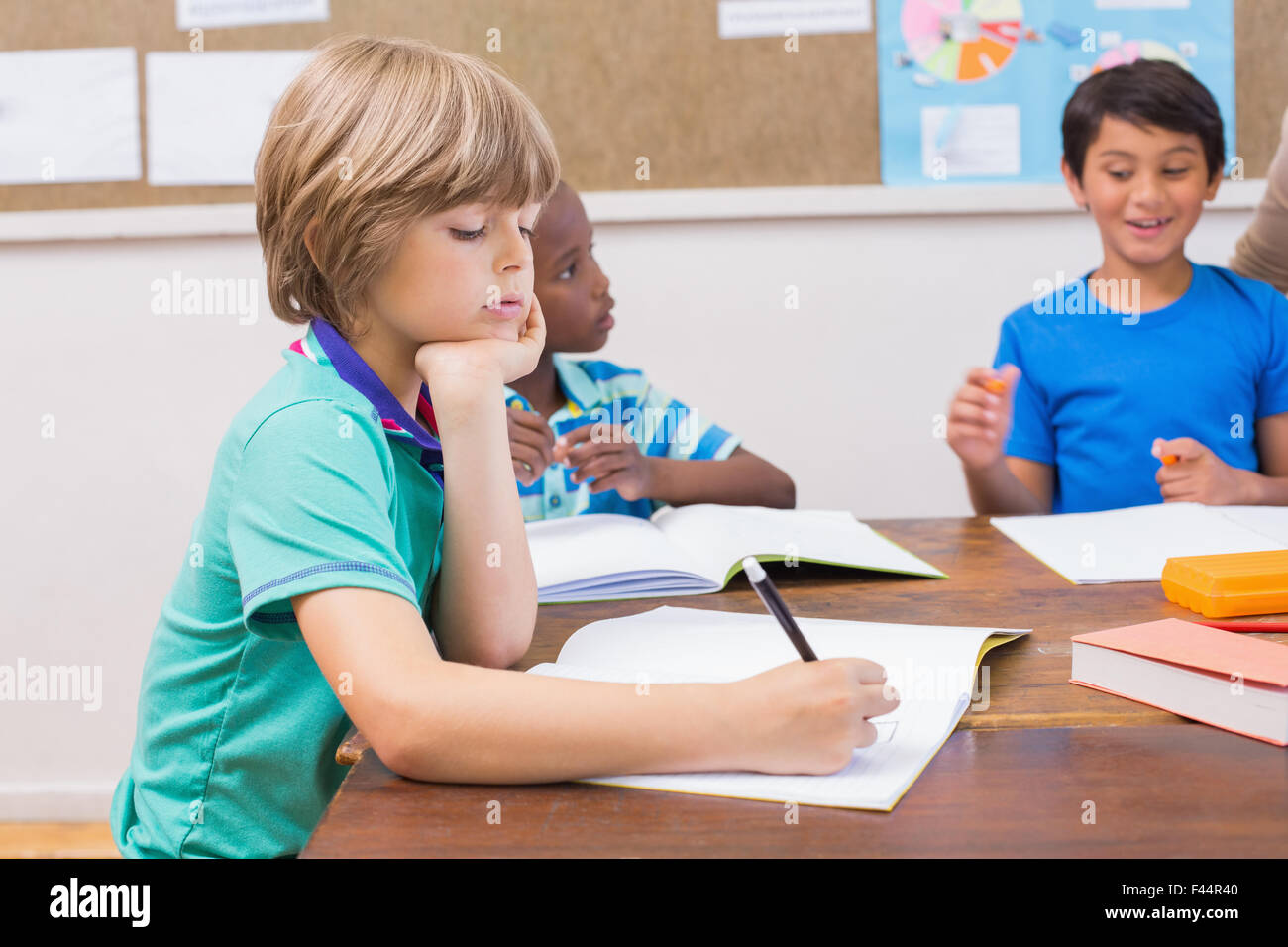 Cute pupils writing desk in hi-res stock photography and images - Alamy