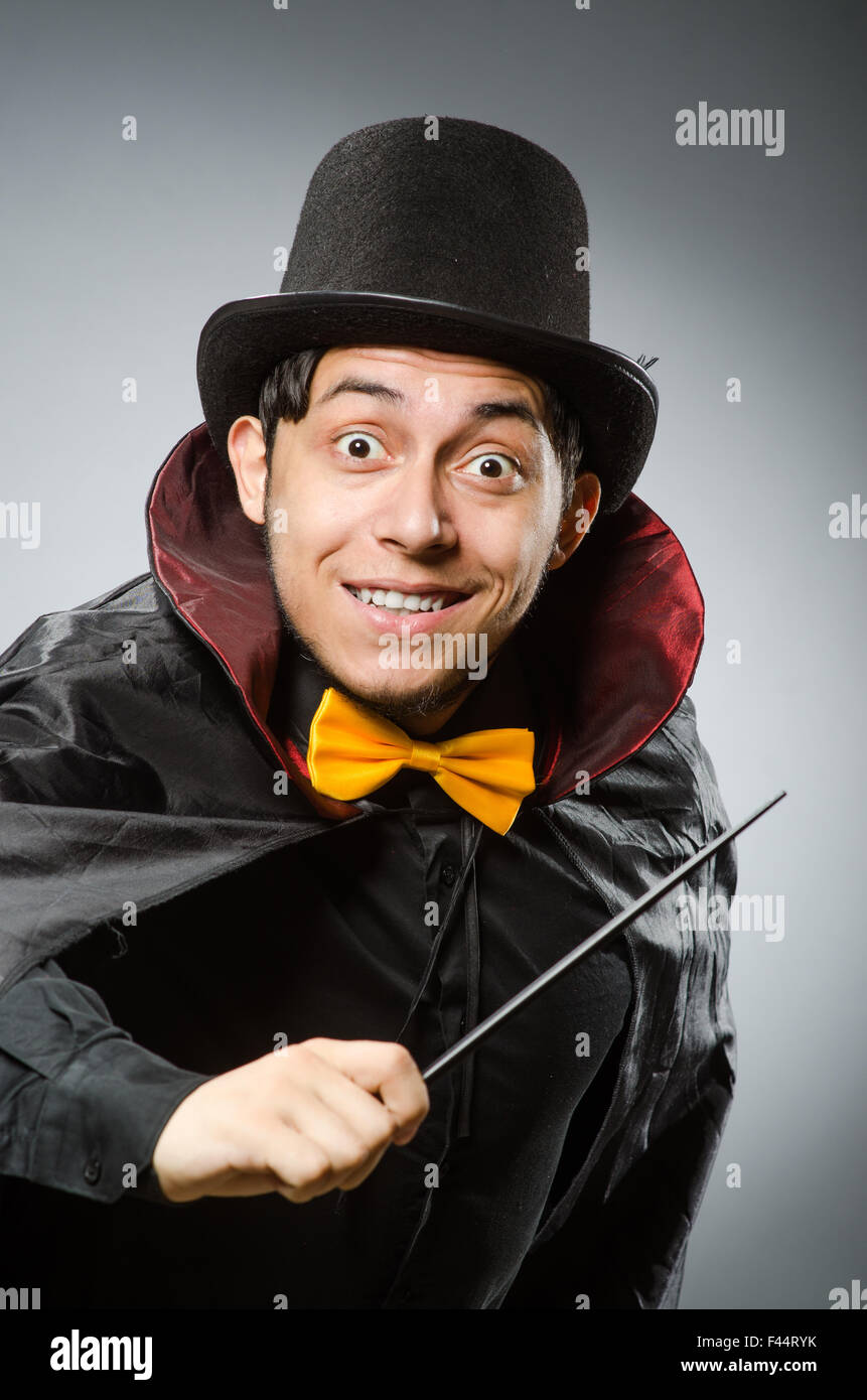 Funny magician man with wand and hat Stock Photo - Alamy