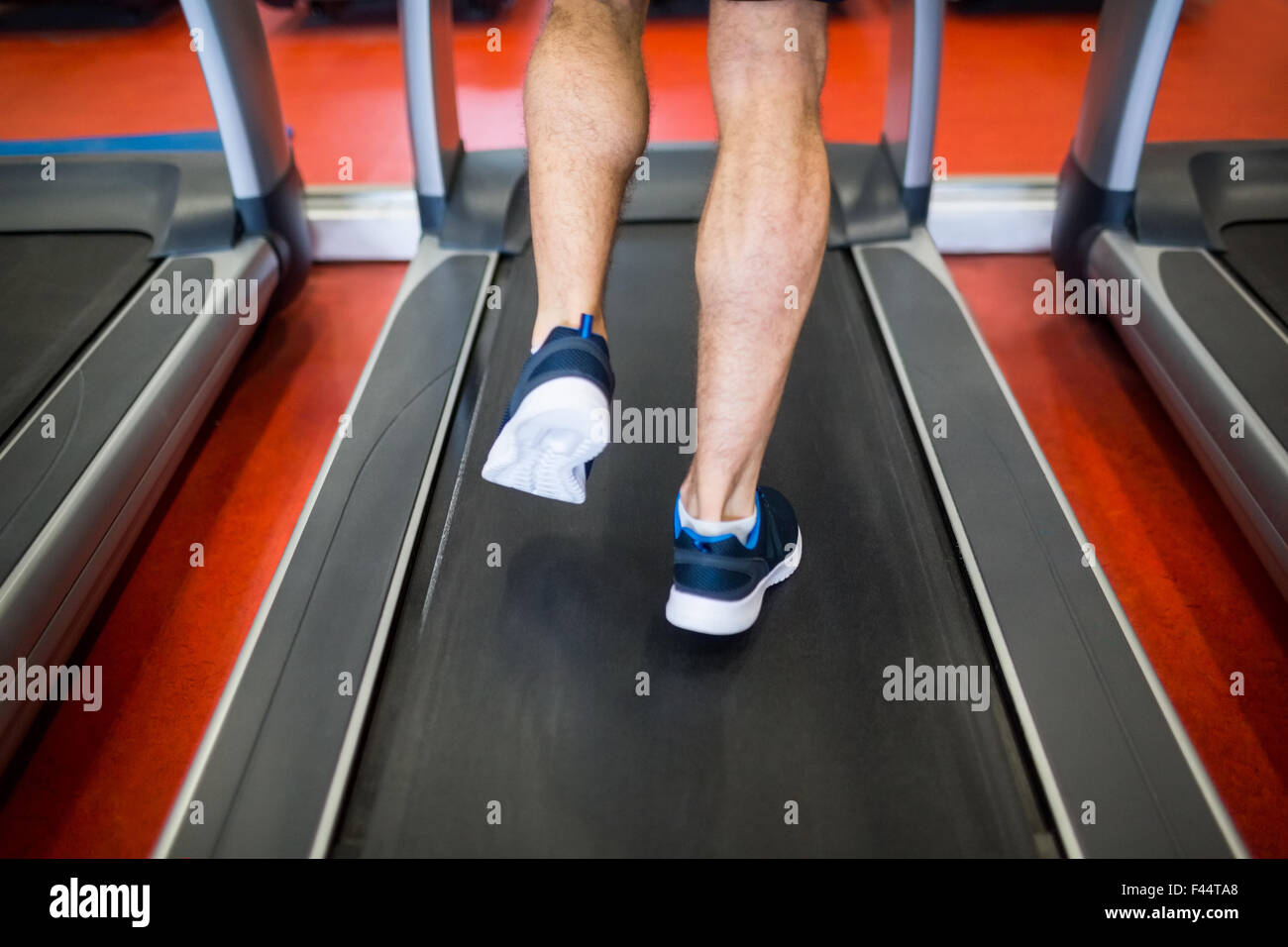 Man running on a treadmill Stock Photo - Alamy