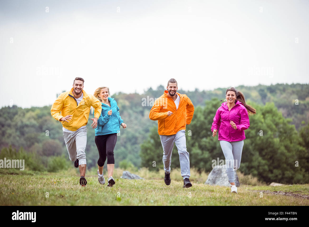Friends jogging on a hike Stock Photo - Alamy