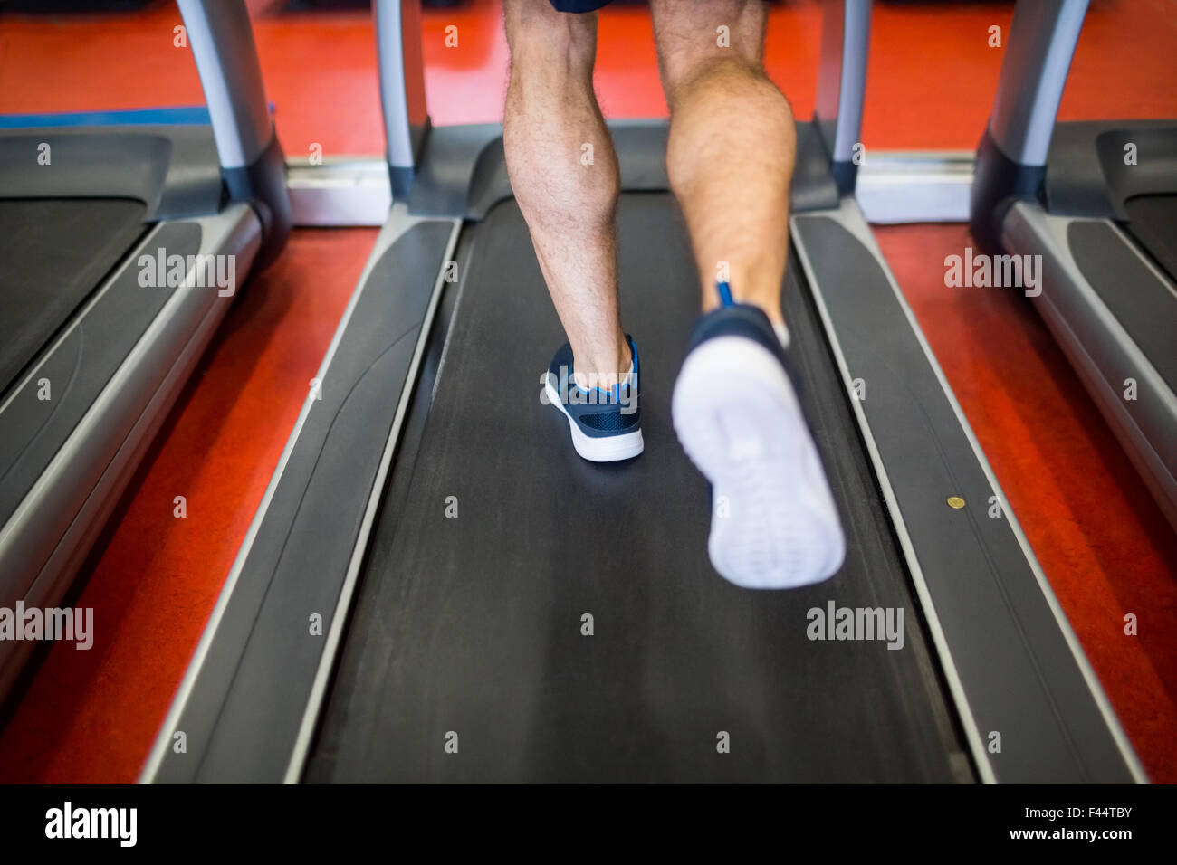 Man running on a treadmill Stock Photo - Alamy